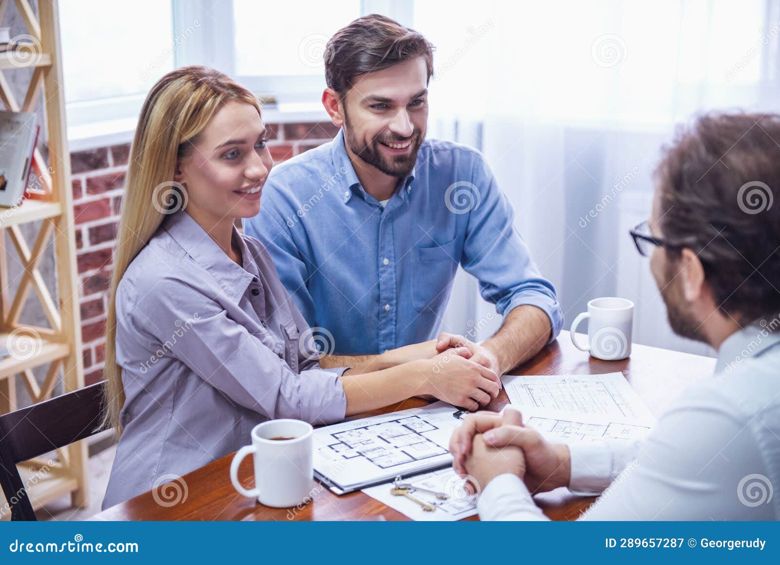 Couple and a realtor stock image. Image of contract - 289657287