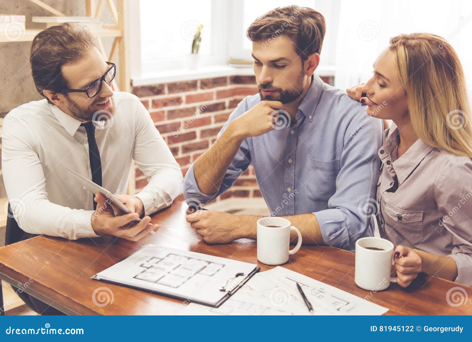 Couple and a realtor stock photo. Image of moving, married - 81945122