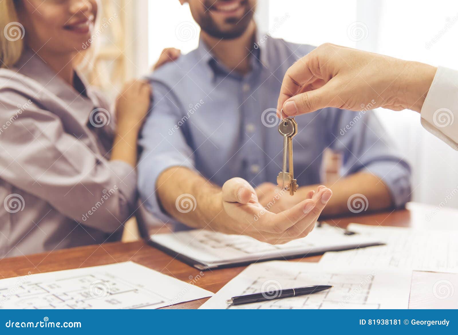 Couple and a realtor stock image. Image of draft, office - 81938181