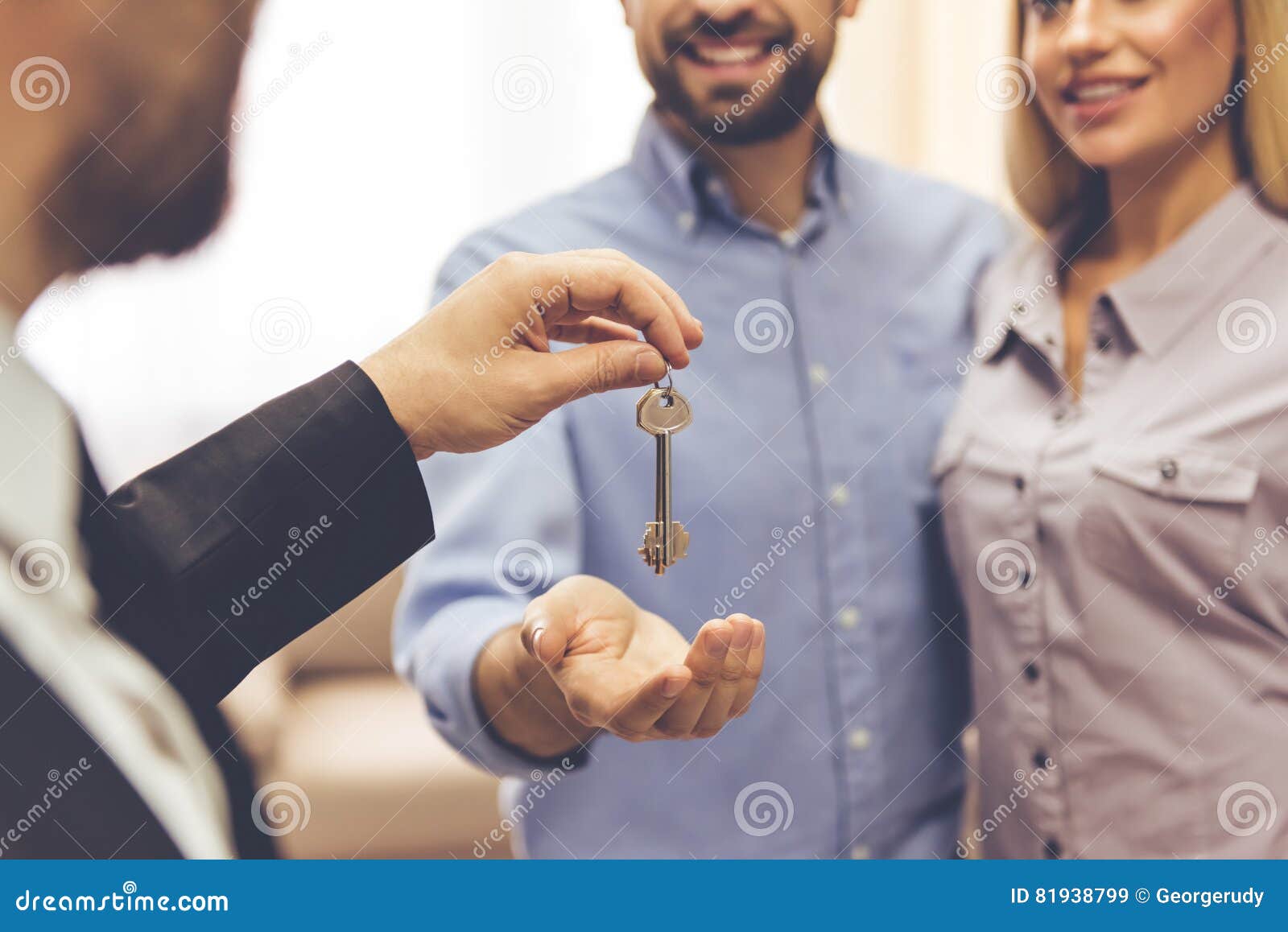 Couple and a realtor stock image. Image of agent, couple - 81938799