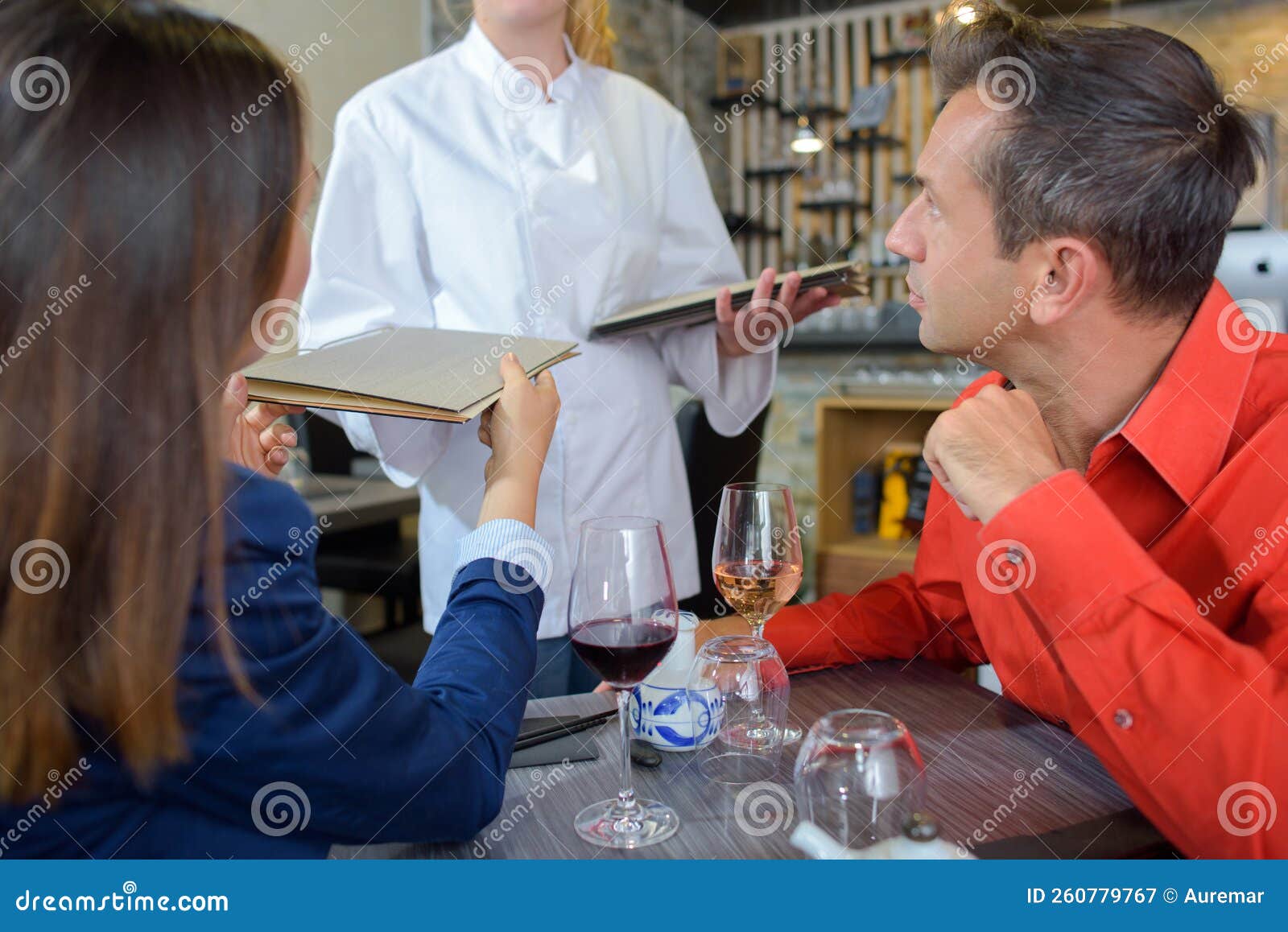 Couple Receiving Menus in Restaurant Stock Image - Image of ...