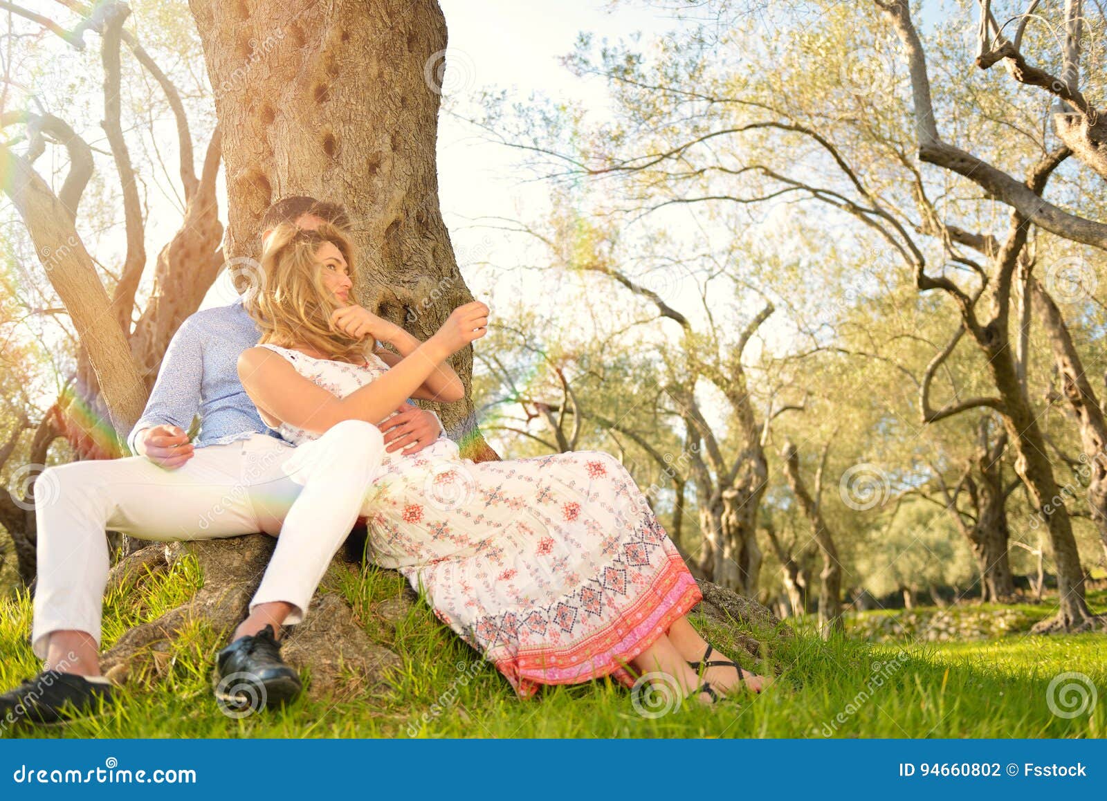 Couple Relax Under the Tree. Fine Art Style. Olive Garden. Stock Photo ...