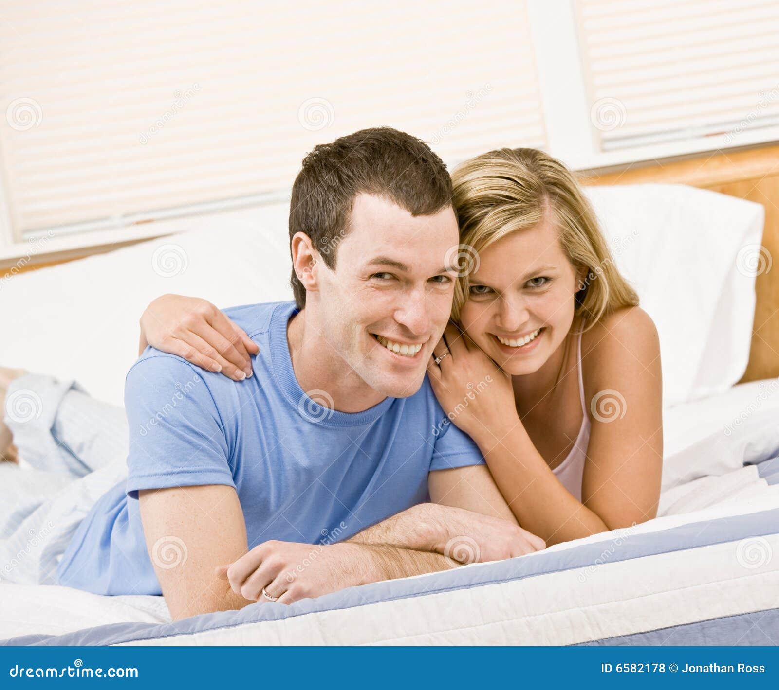 Couple Relaxing and Hugging in Bed Stock Photo - Image of lifestyles ...