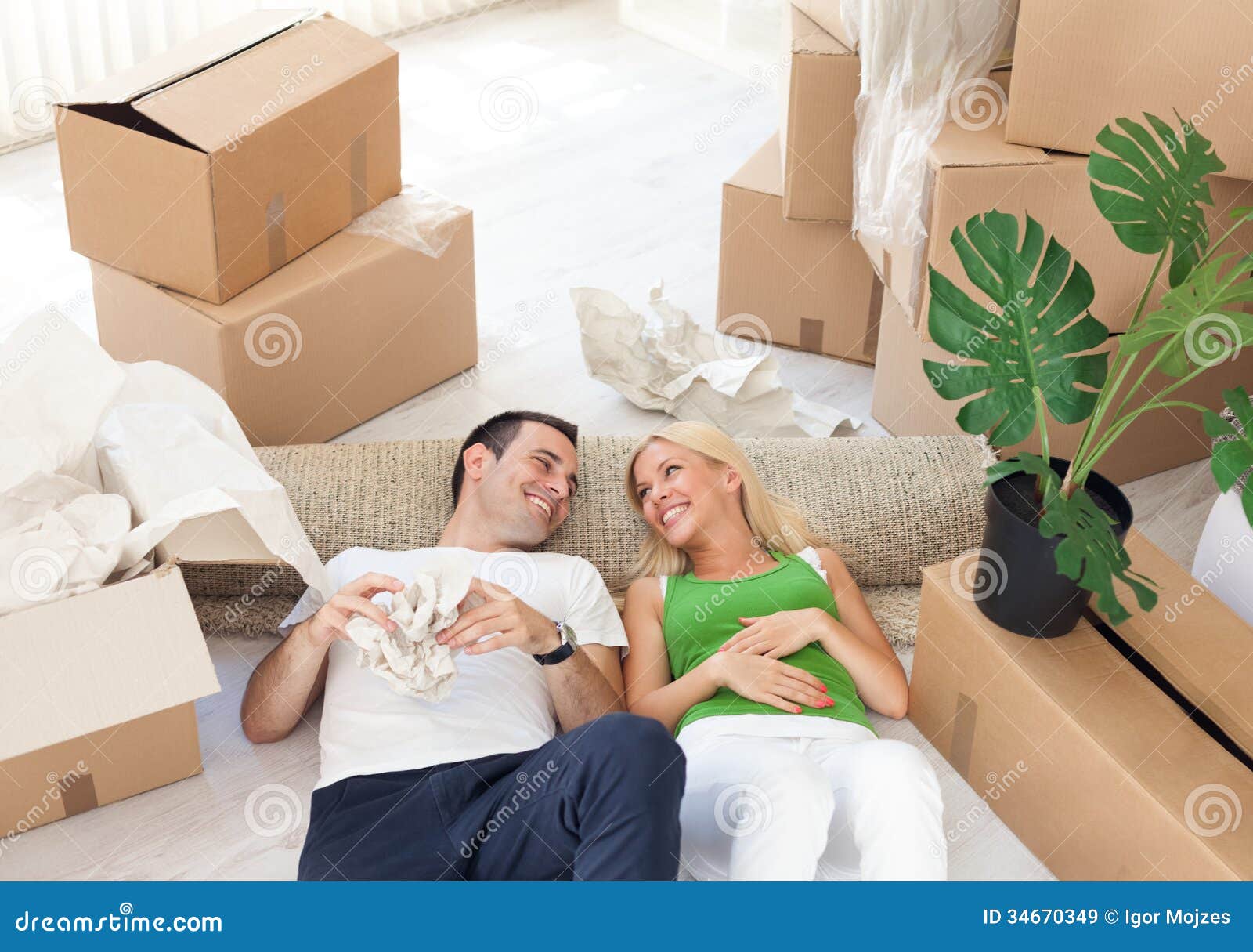 Couple Relaxing in the Middle of Boxes Stock Image - Image of apartment ...