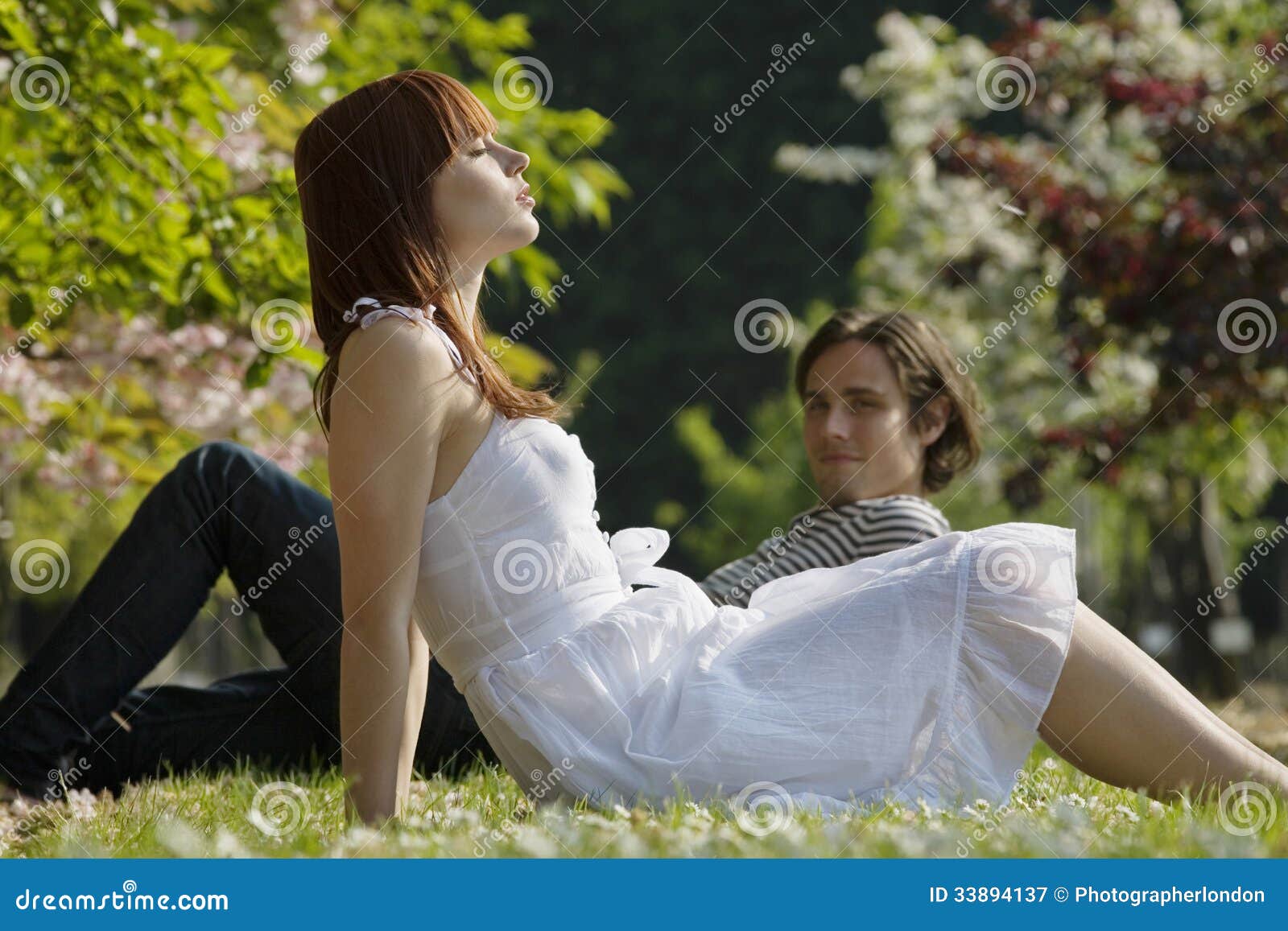 Couple Relaxing in Park stock image. Image of happiness - 33894137