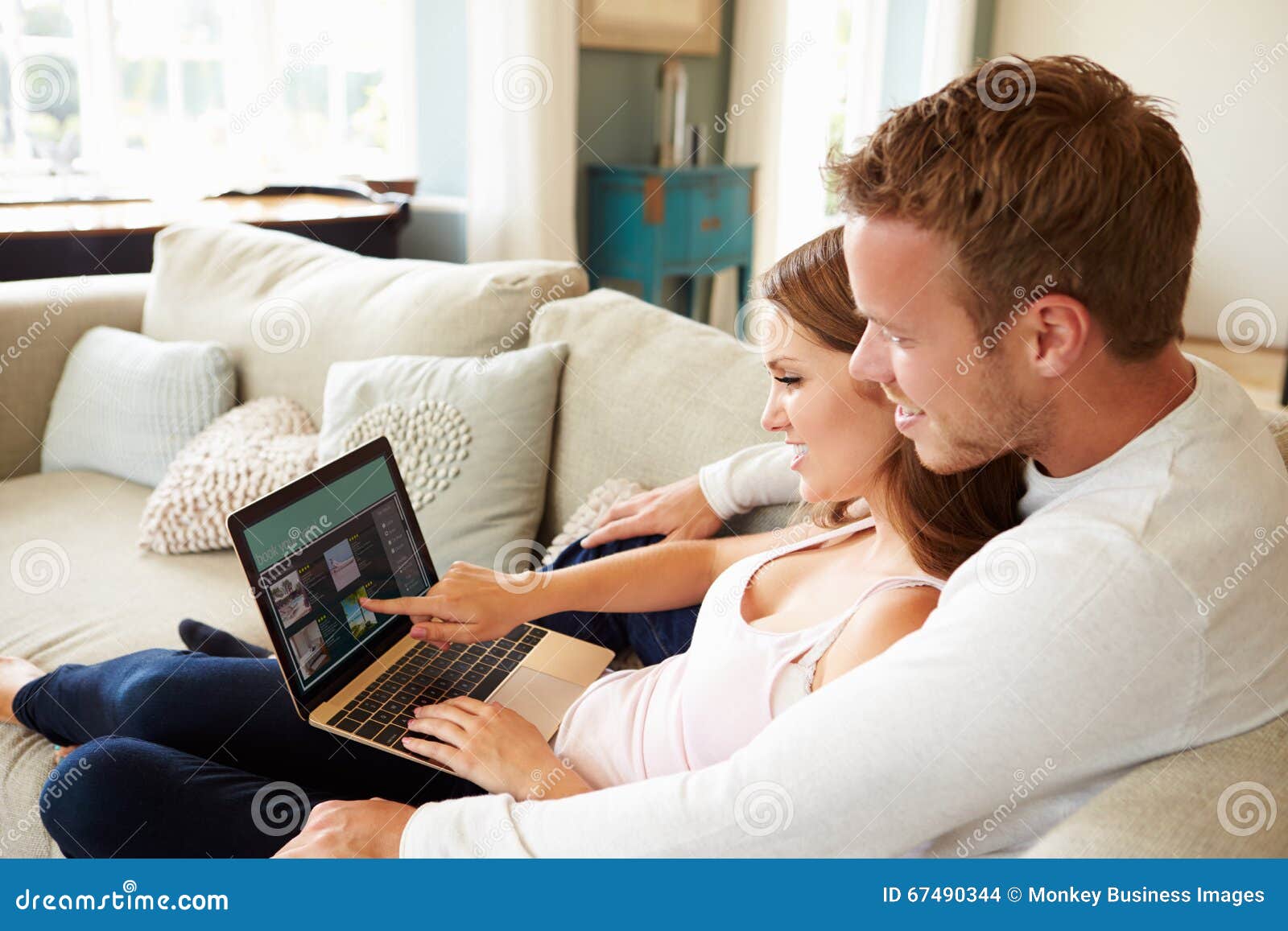 Couple Relaxing on Sofa Using Laptop Computer Together Stock Photo ...