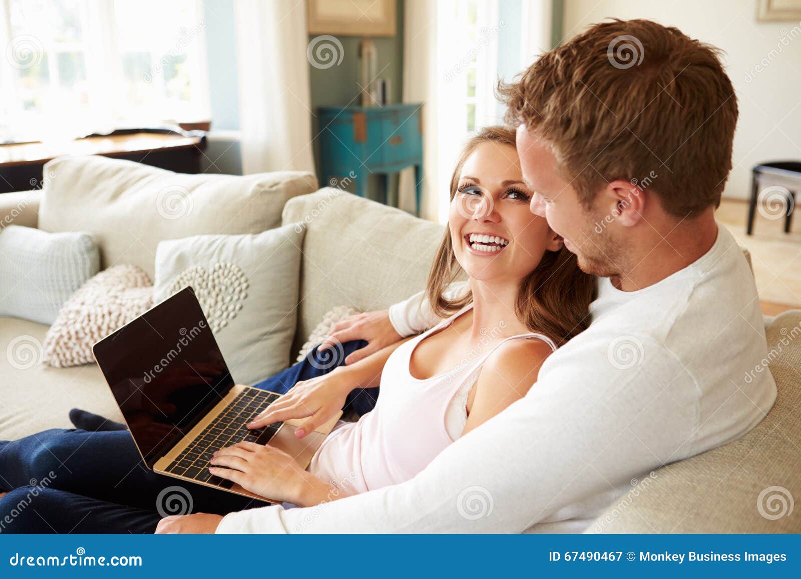 Couple Relaxing on Sofa Using Laptop Computer Together Stock Image ...