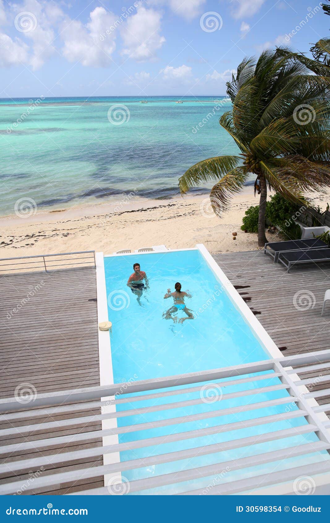 Couple Relaxing in Tropical Swimming Pool Stock Photo - Image of ...