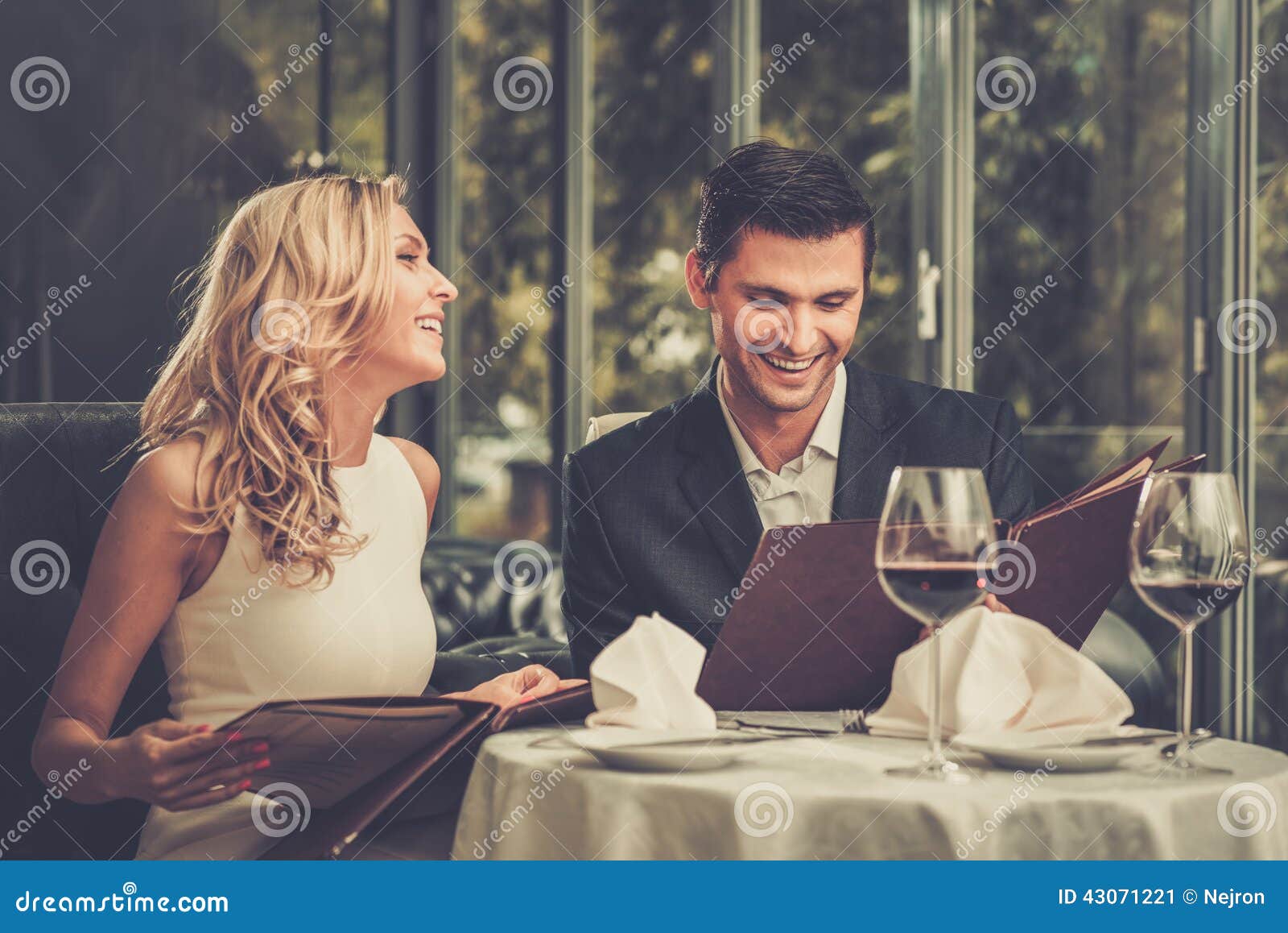 Couple in a restaurant stock image. Image of glamour - 43071221