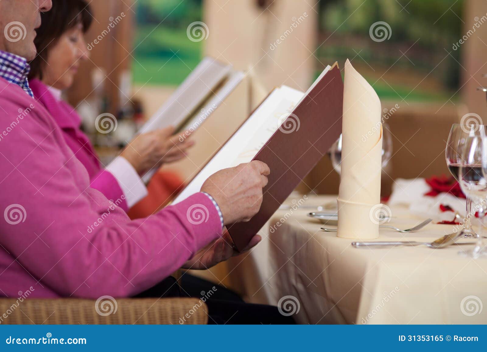 Couple in Restaurant Reading the Menu Stock Image - Image of customer ...