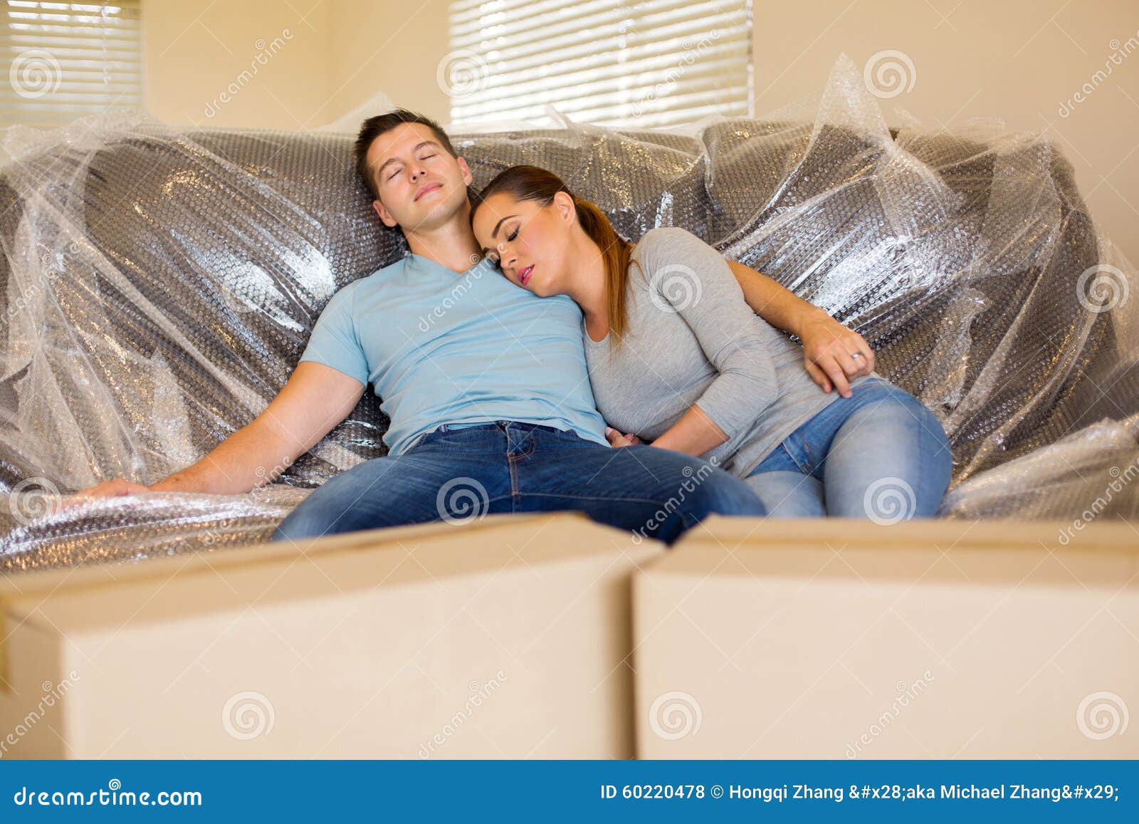 Couple resting on couch stock photo. Image of girlfriend - 60220478