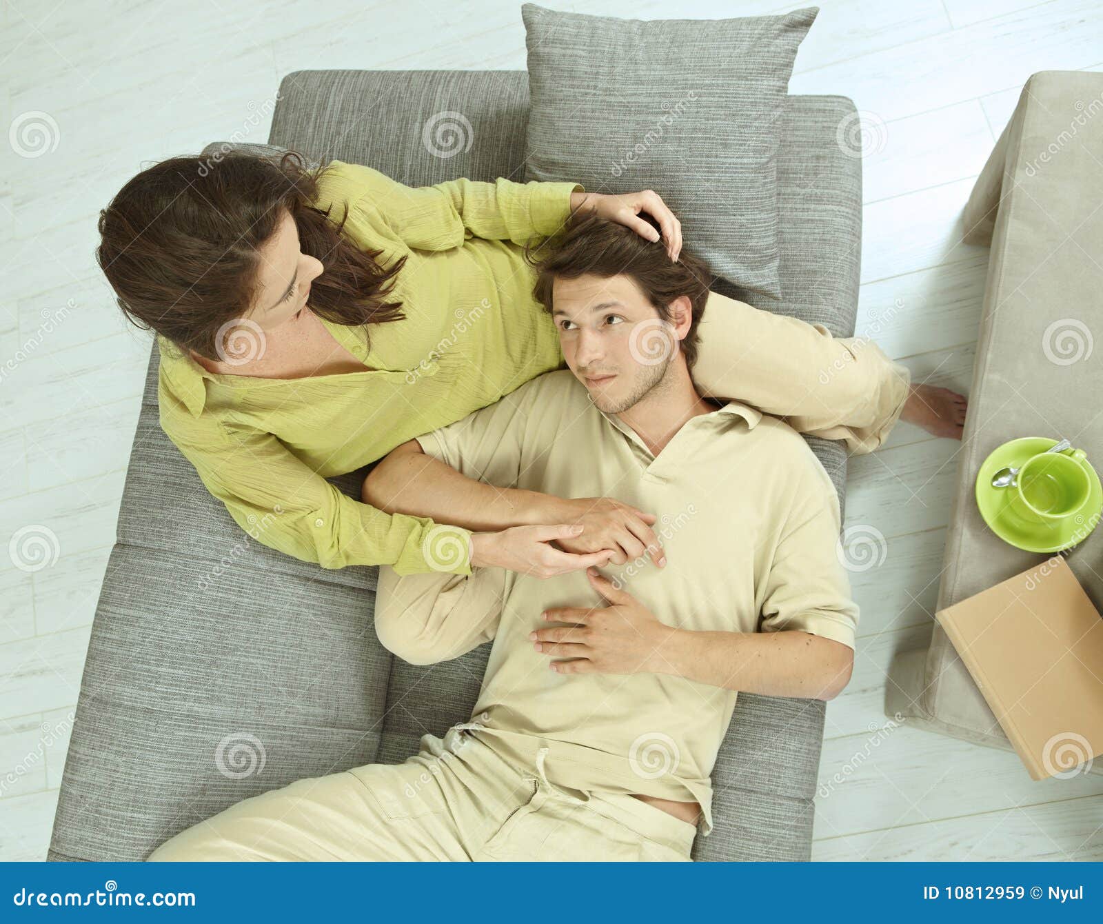 Couple resting a home stock image. Image of furniture - 10812959