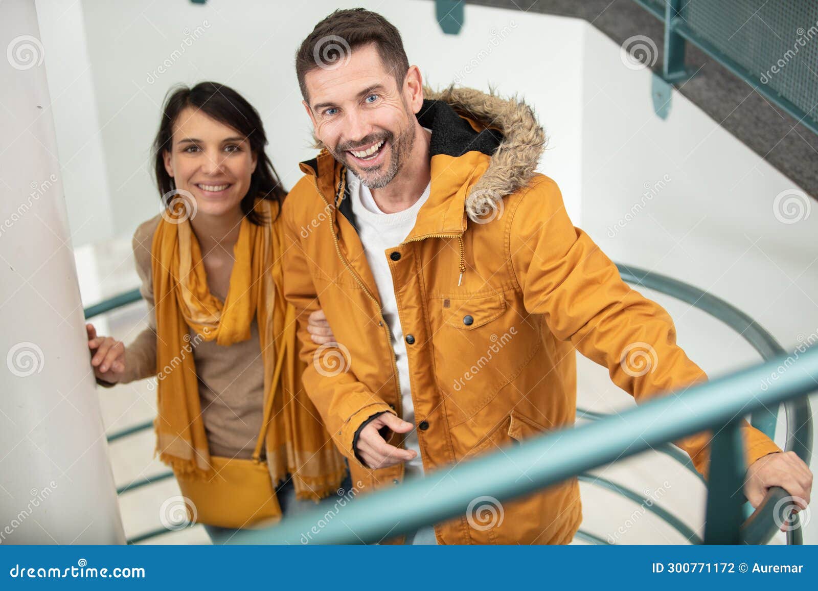 Couple Returning Home Going Up Staircase Stock Photo - Image of smiling ...