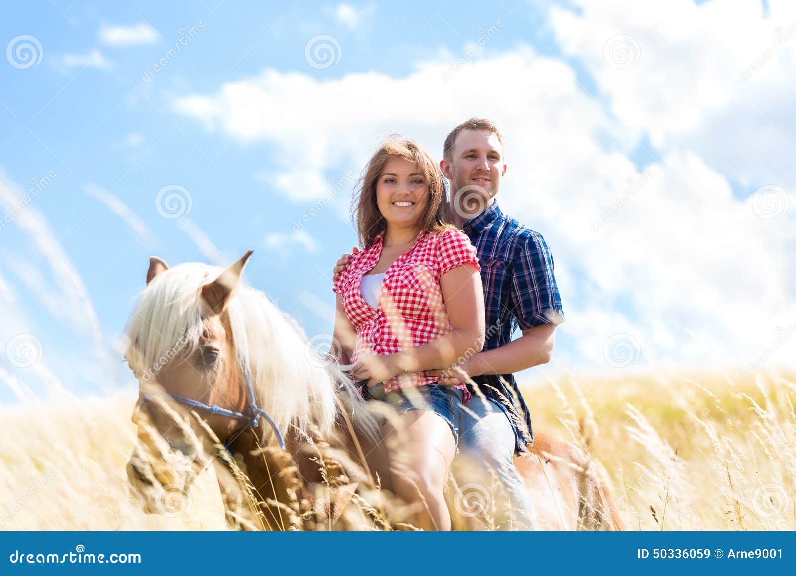 Couple Riding on Horse in Meadow Stock Image - Image of summer, person ...