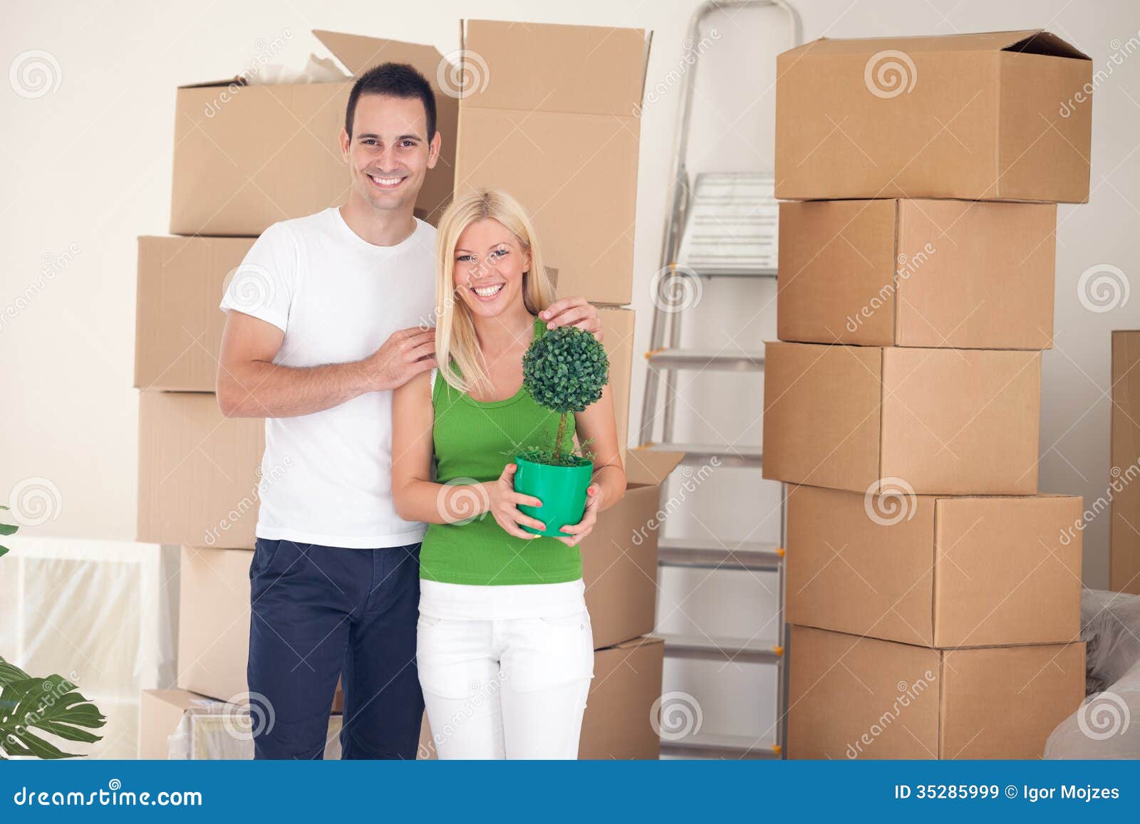 Couple In Room Full Of Cardboard Boxes Stock Image Image Of Happy
