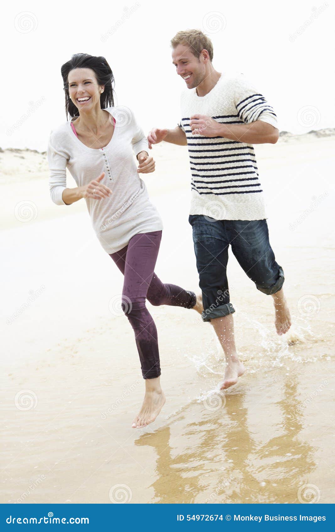 Couple Running Along Beach Together Stock Photo - Image of seaside ...