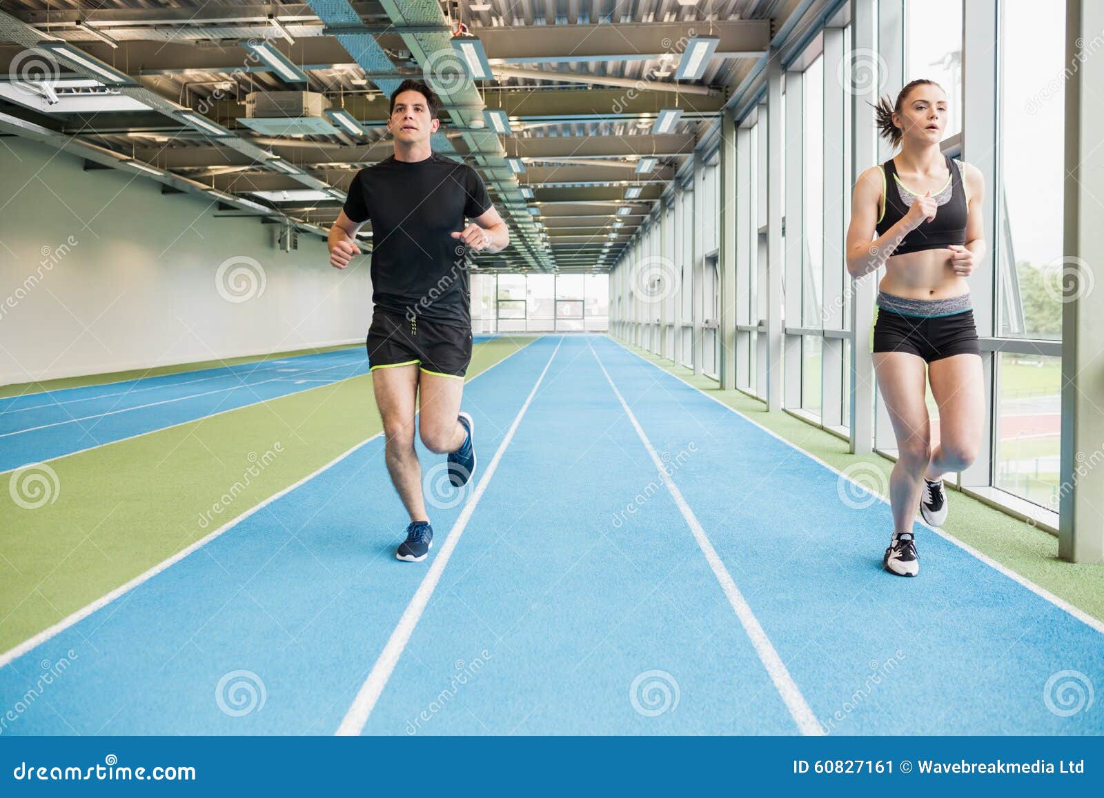 Couple Running on the Indoor Track Stock Image - Image of adult, pretty ...