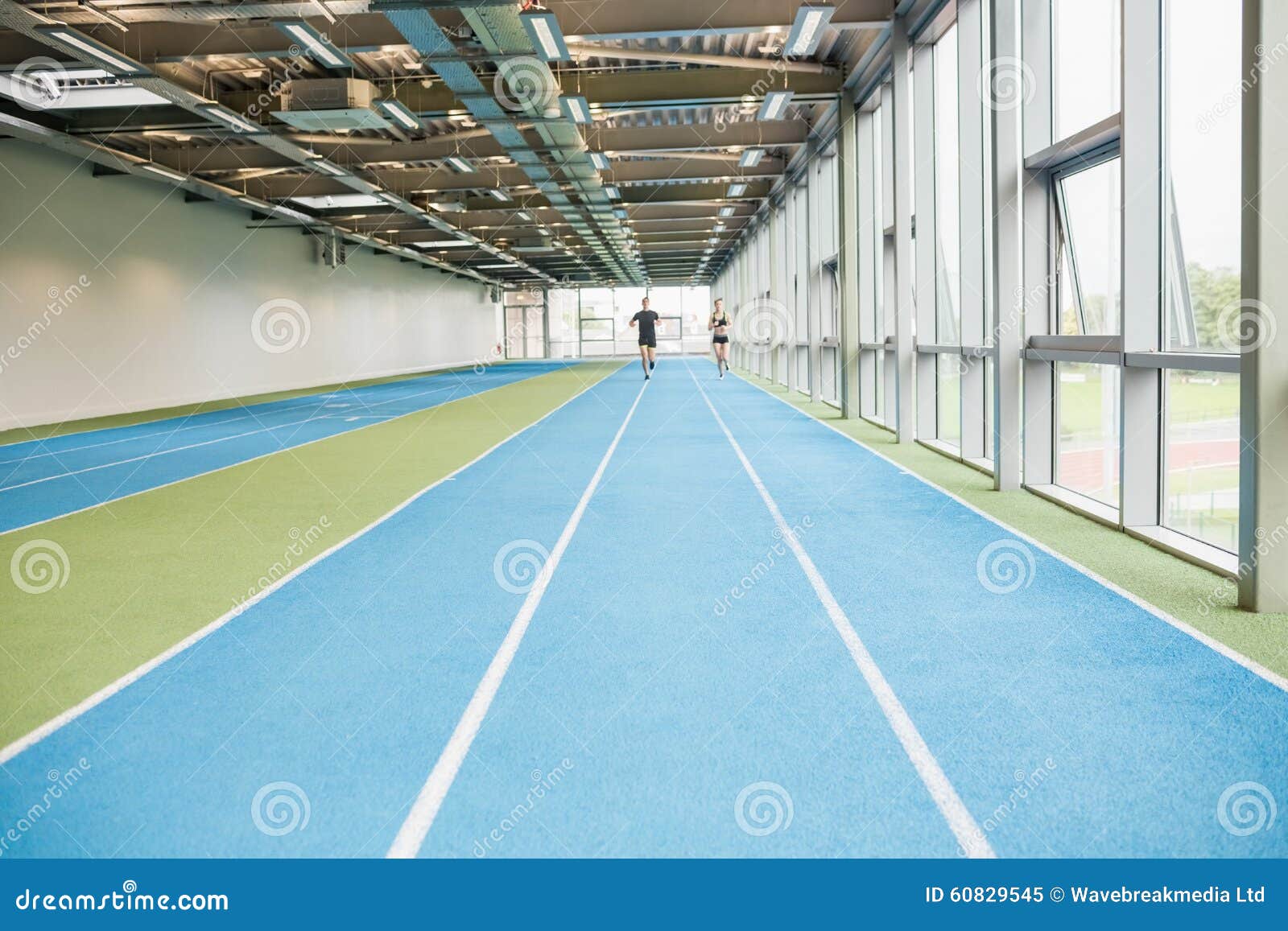 Couple Running on the Indoor Track Stock Image - Image of physique ...