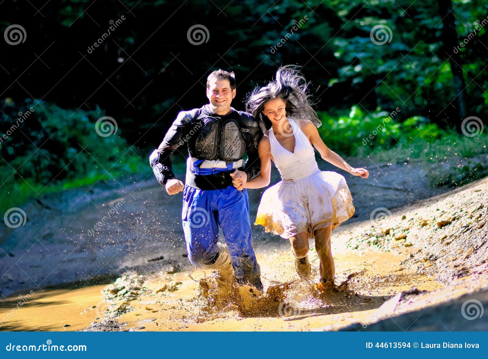 Couple Running through the Mud Stock Photo - Image of married, motor ...