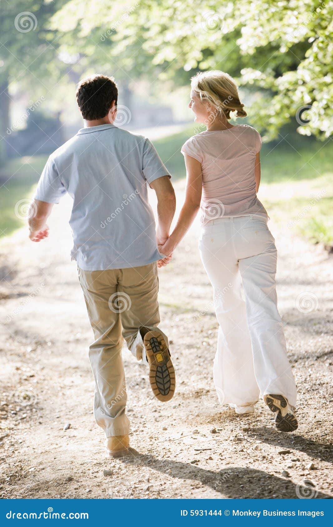 Couple Running Outdoors Holding Hands Stock Photo - Image: 5931444