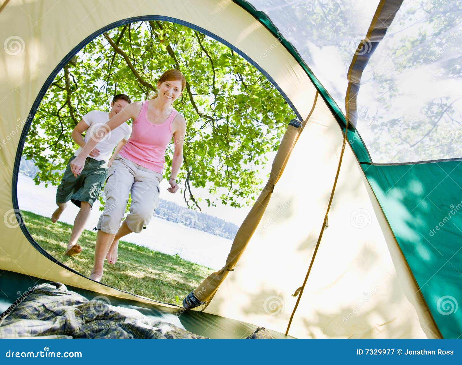 Couple running to tent stock image. Image of european - 7329977