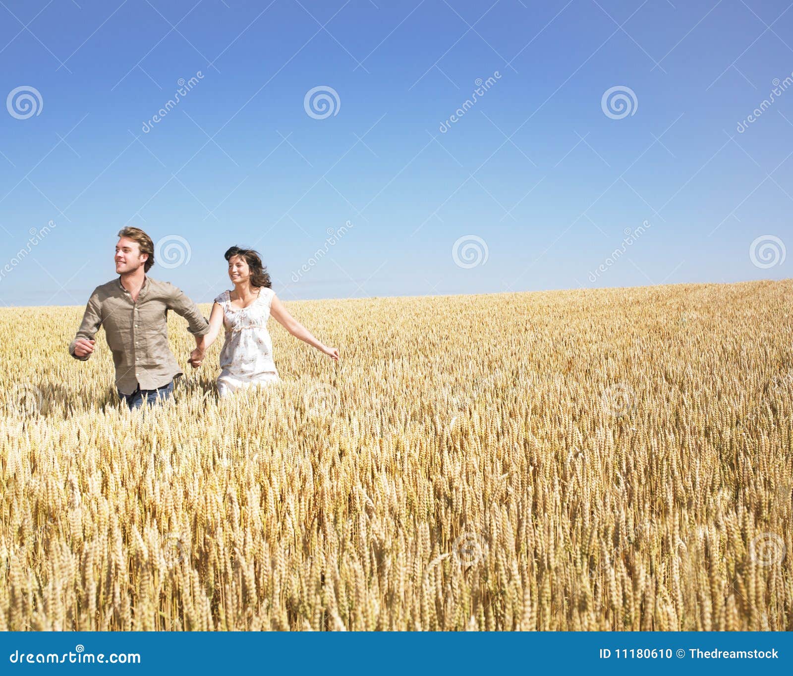 Couple Running in Wheat Field Stock Photo - Image of people, hand: 11180610