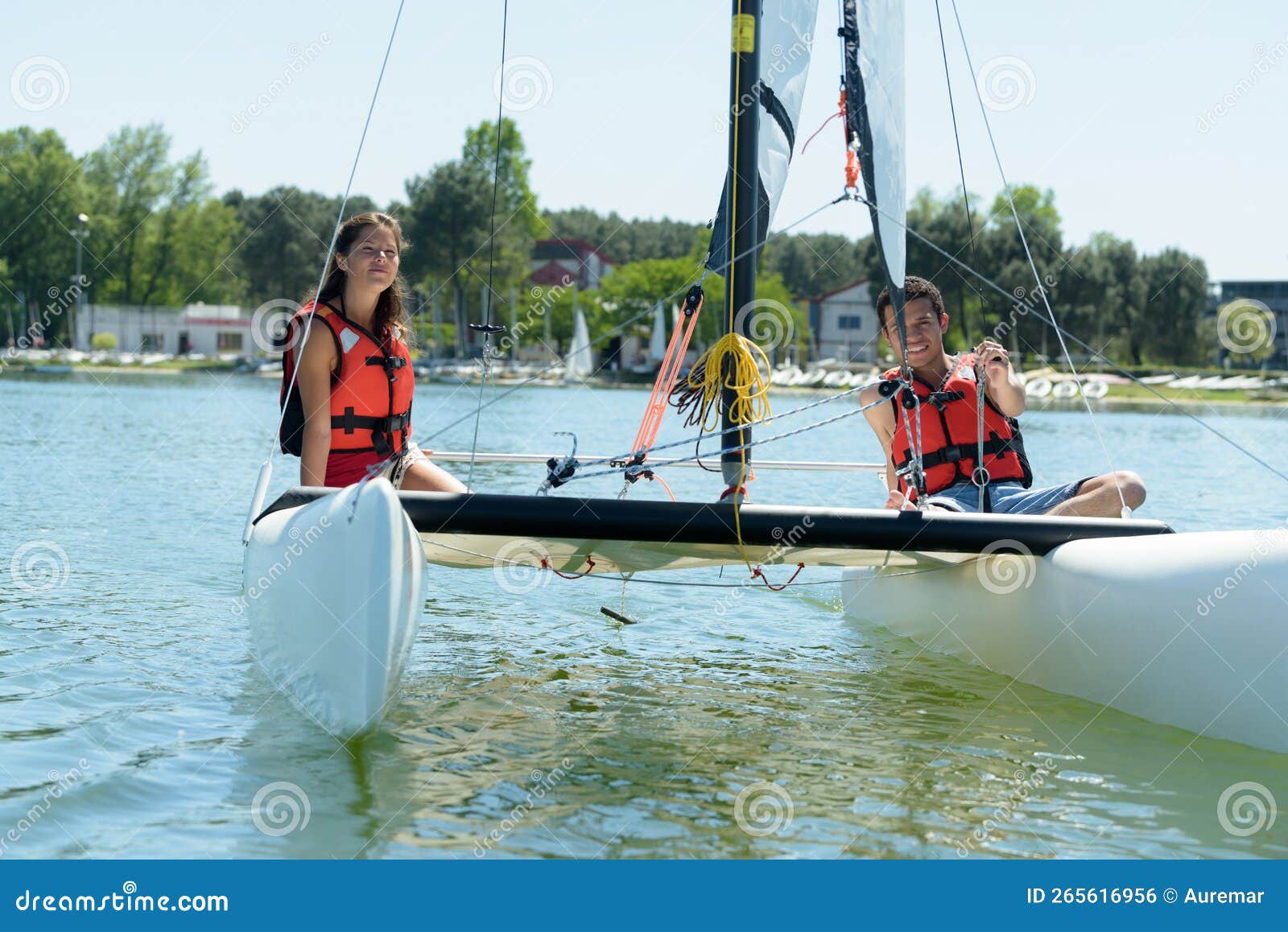 Couple sailing in lake stock photo. Image of surf, boat - 265616956