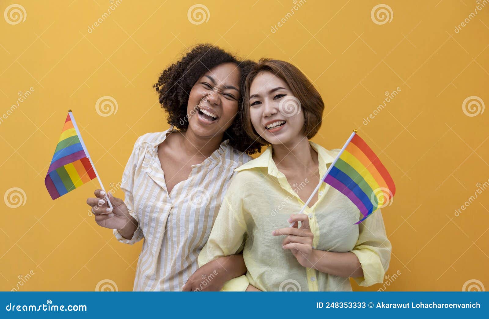 Couple Of Same Sex Marriage Holding Lgbtq Rainbow Flag For Pride Month