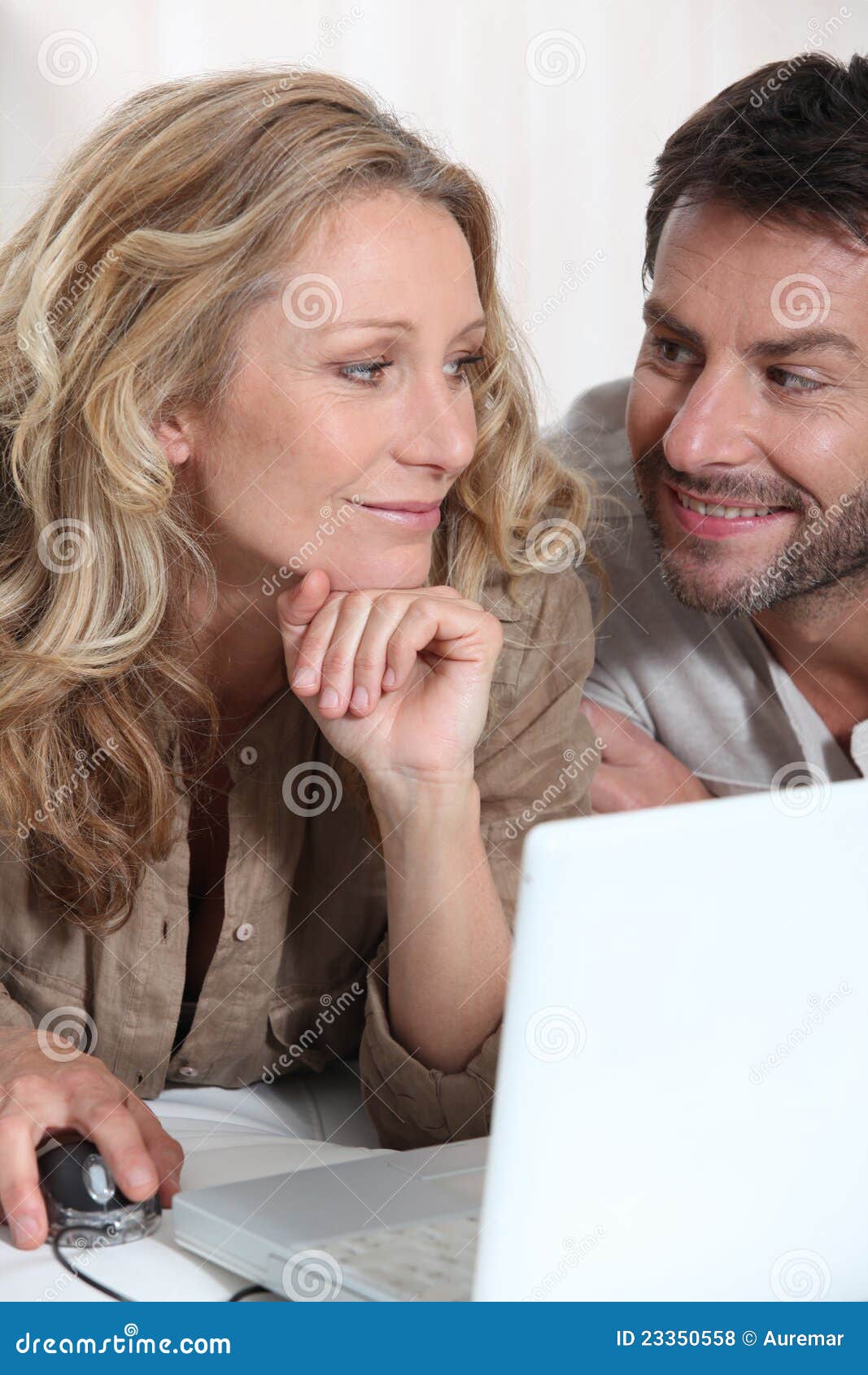 Couple sat by computer stock photo. Image of relaxation - 23350558