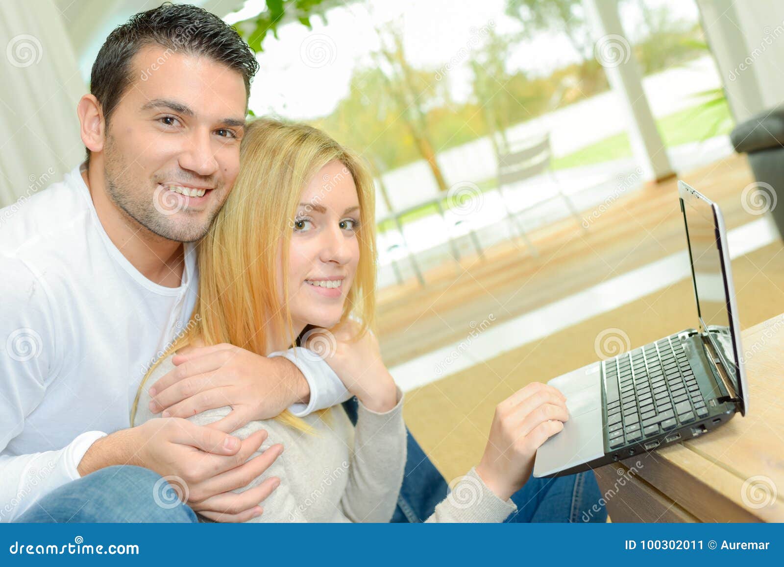 Couple Sat at Home with Laptop Computer Stock Image - Image of notebook ...