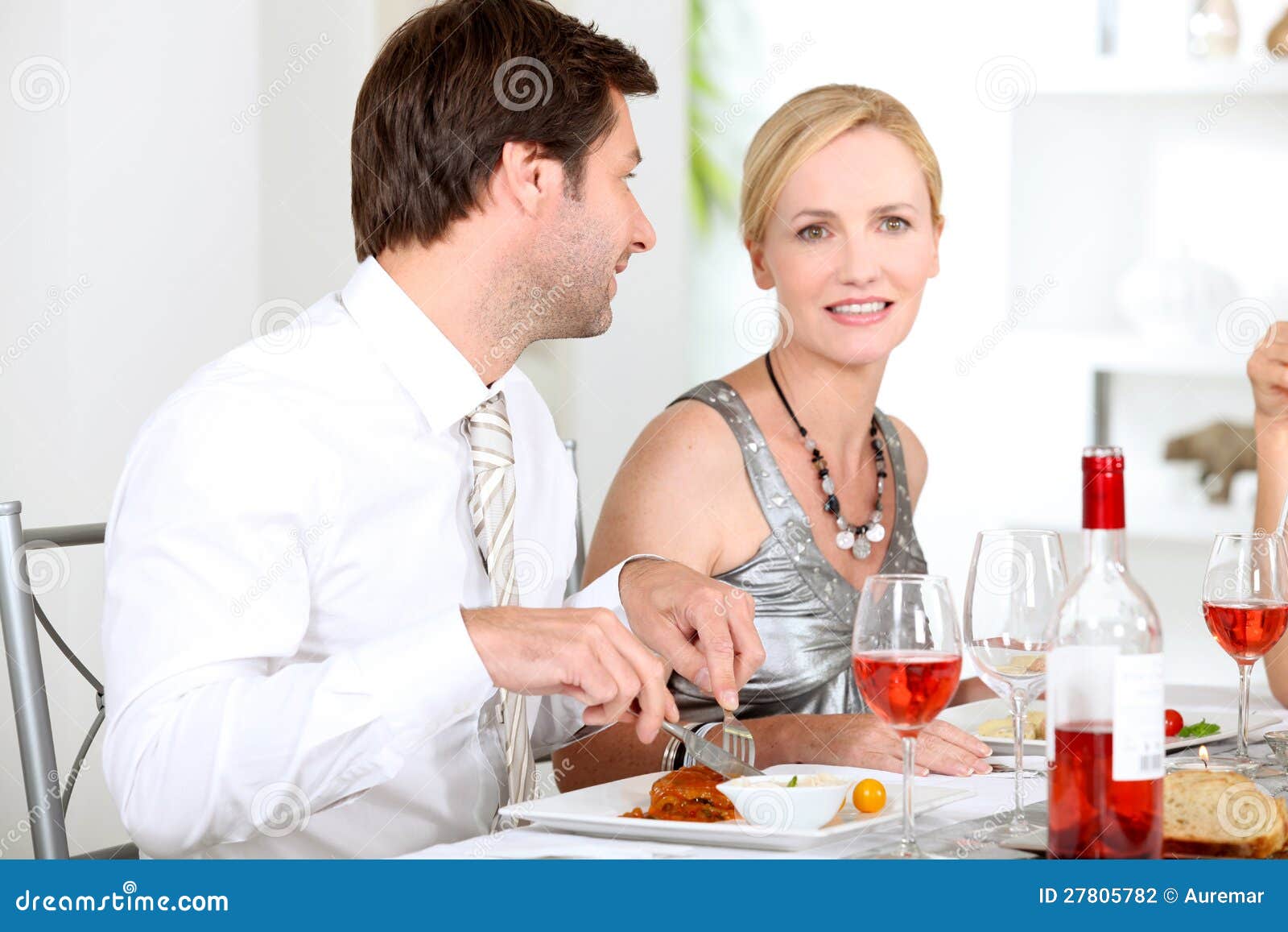 Couple Sat at Table Eating Meal Stock Photo - Image of husband, dark ...