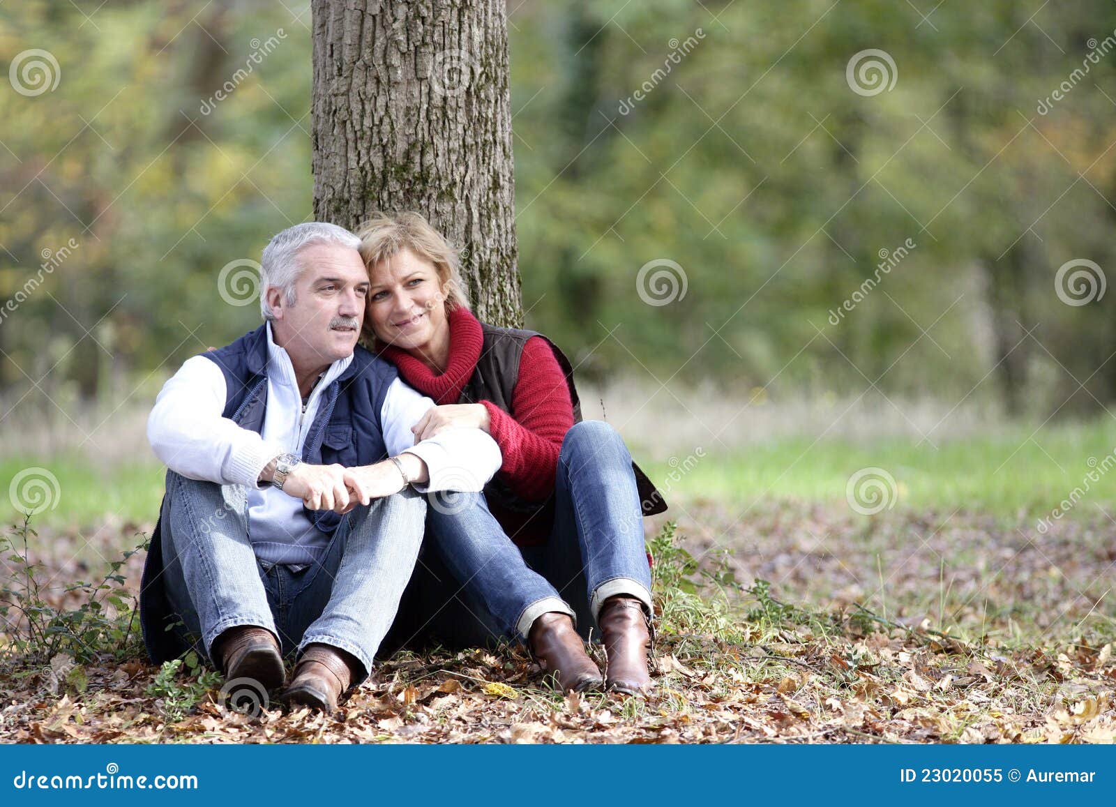 Couple sat by tree stock image. Image of together, grass - 23020055