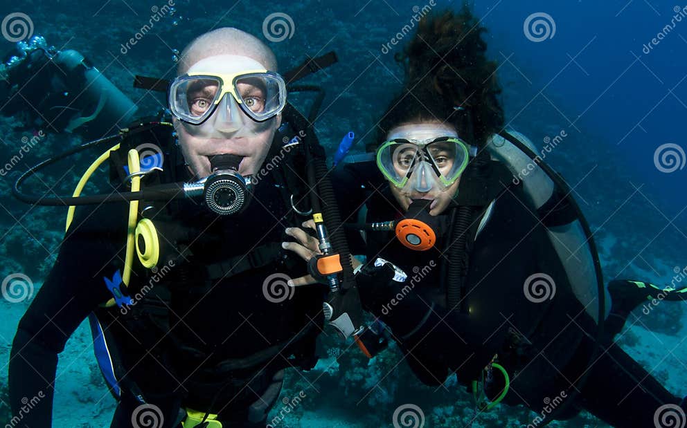 Couple scuba diving stock image. Image of activity, colourful - 15220179