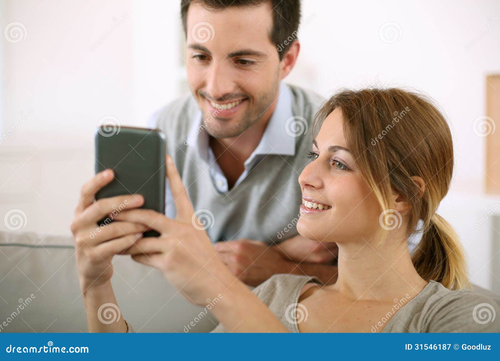 Couple Sending Message on Smartphone from House Stock Image - Image of ...