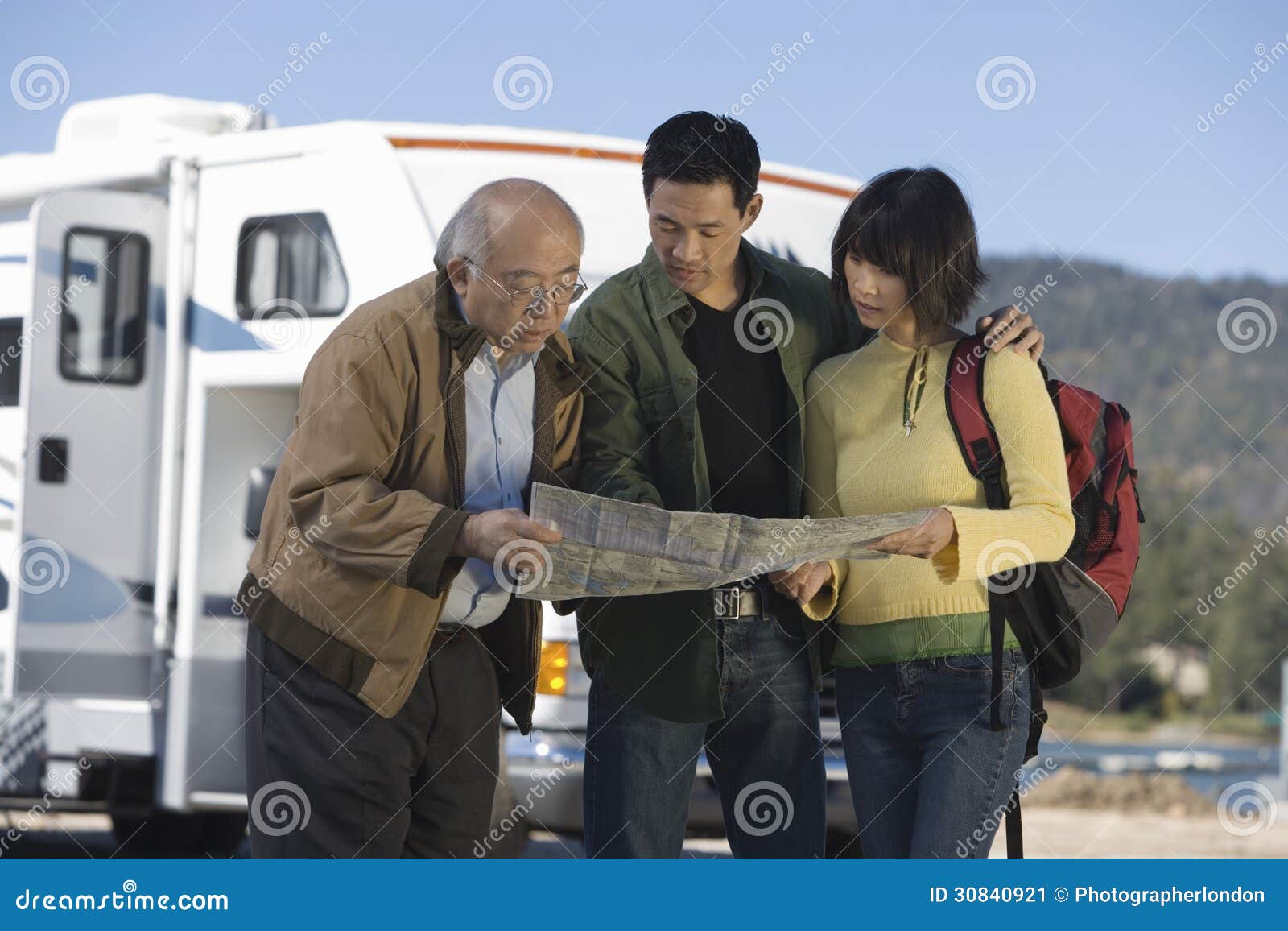 Couple and Senior Father Reading Map Outside RV Stock Image - Image of ...