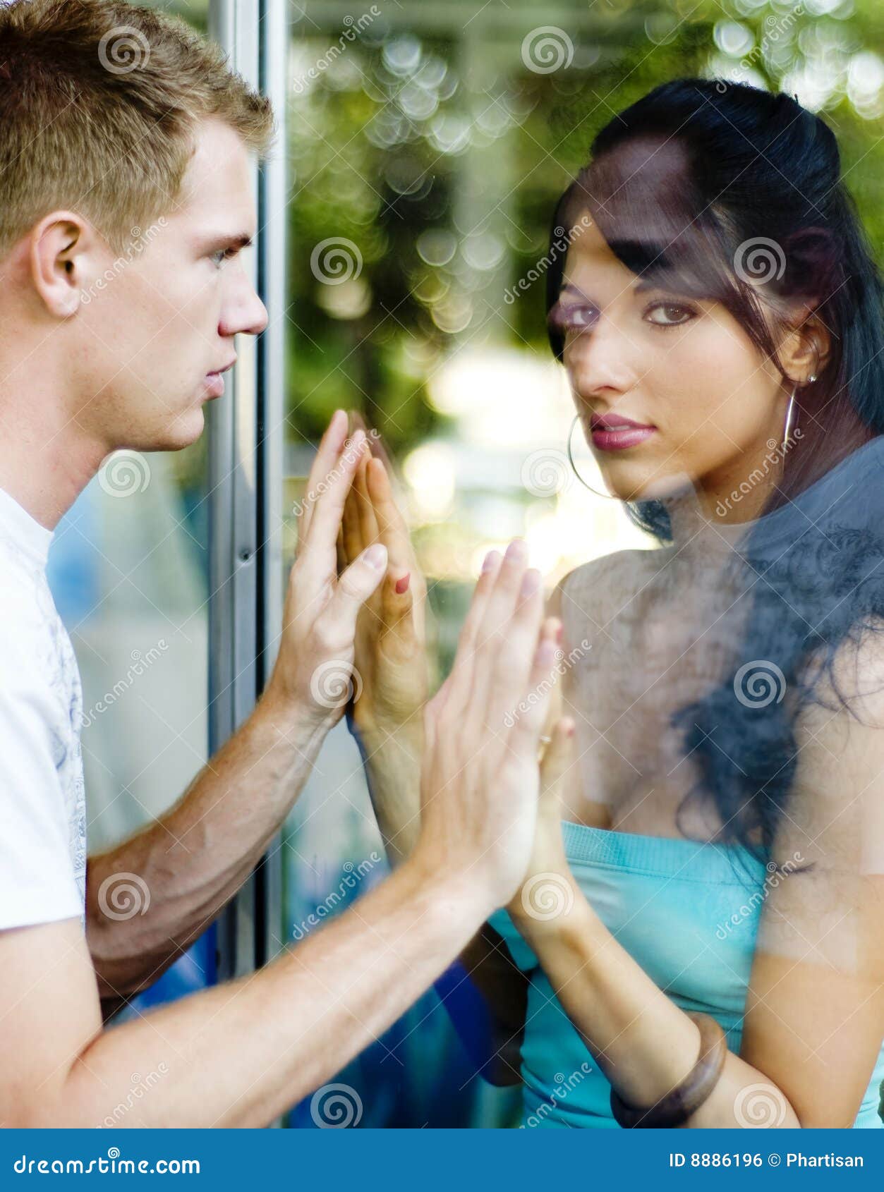 Couple separated by glass stock photo. Image of divide - 8886196