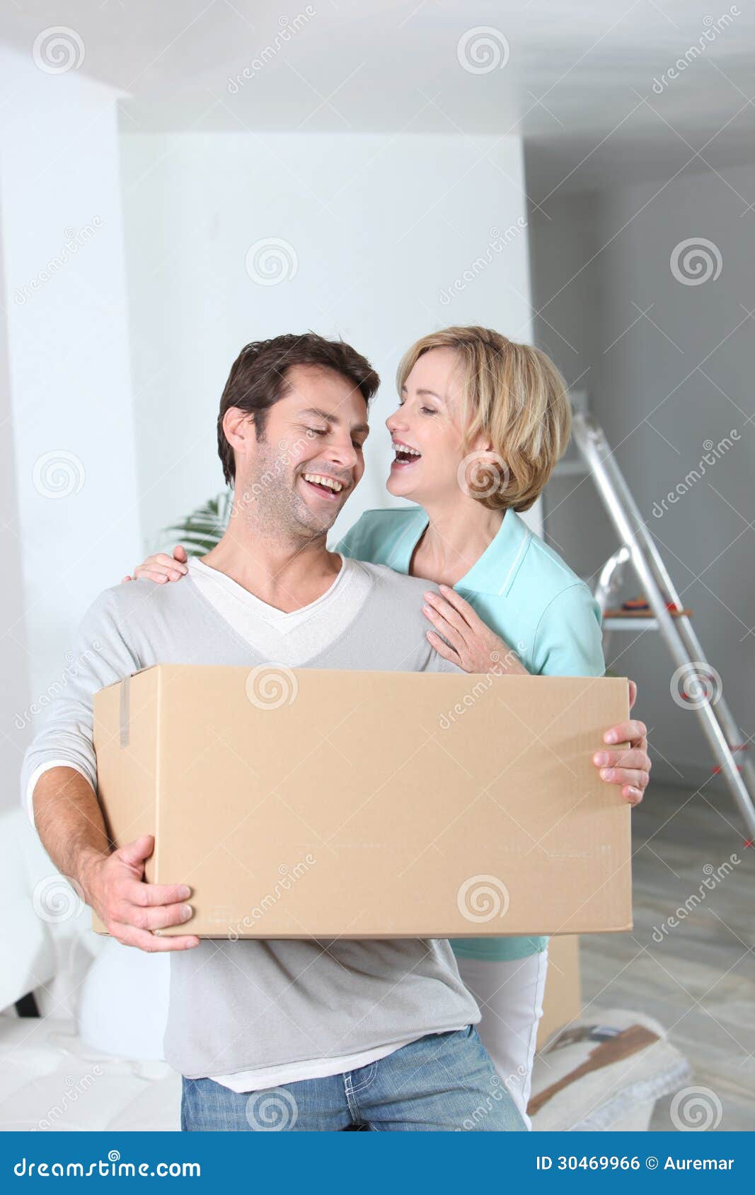 Couple setting up home stock photo. Image of ceilings - 30469966