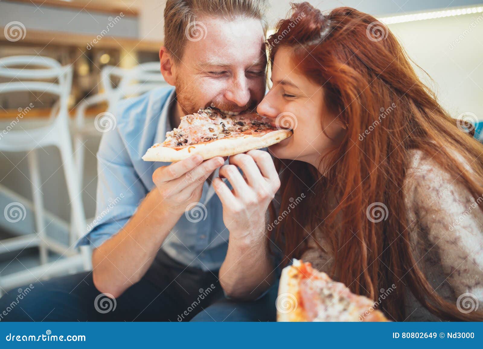 Couple Sharing Pizza and Eating Stock Image - Image of enjoying ...