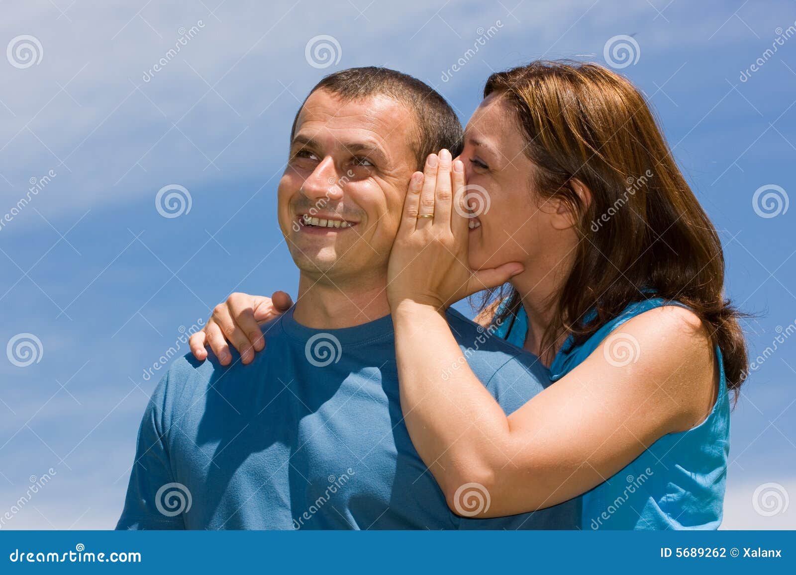 Couple sharing secrets stock photo. Image of beautiful - 5689262