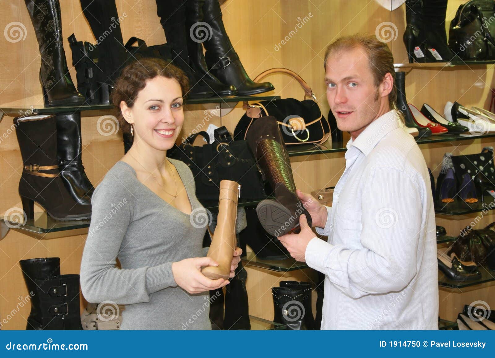 Couple in a shoes shop stock photo. Image of customer - 1914750