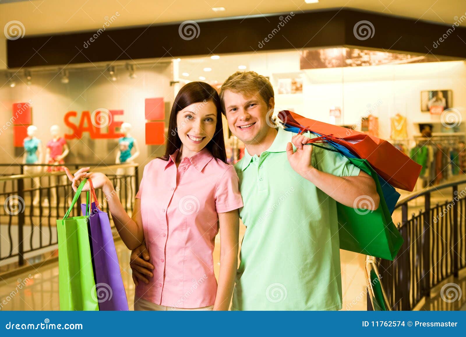Couple of shopaholics stock photo. Image of affection - 11762574