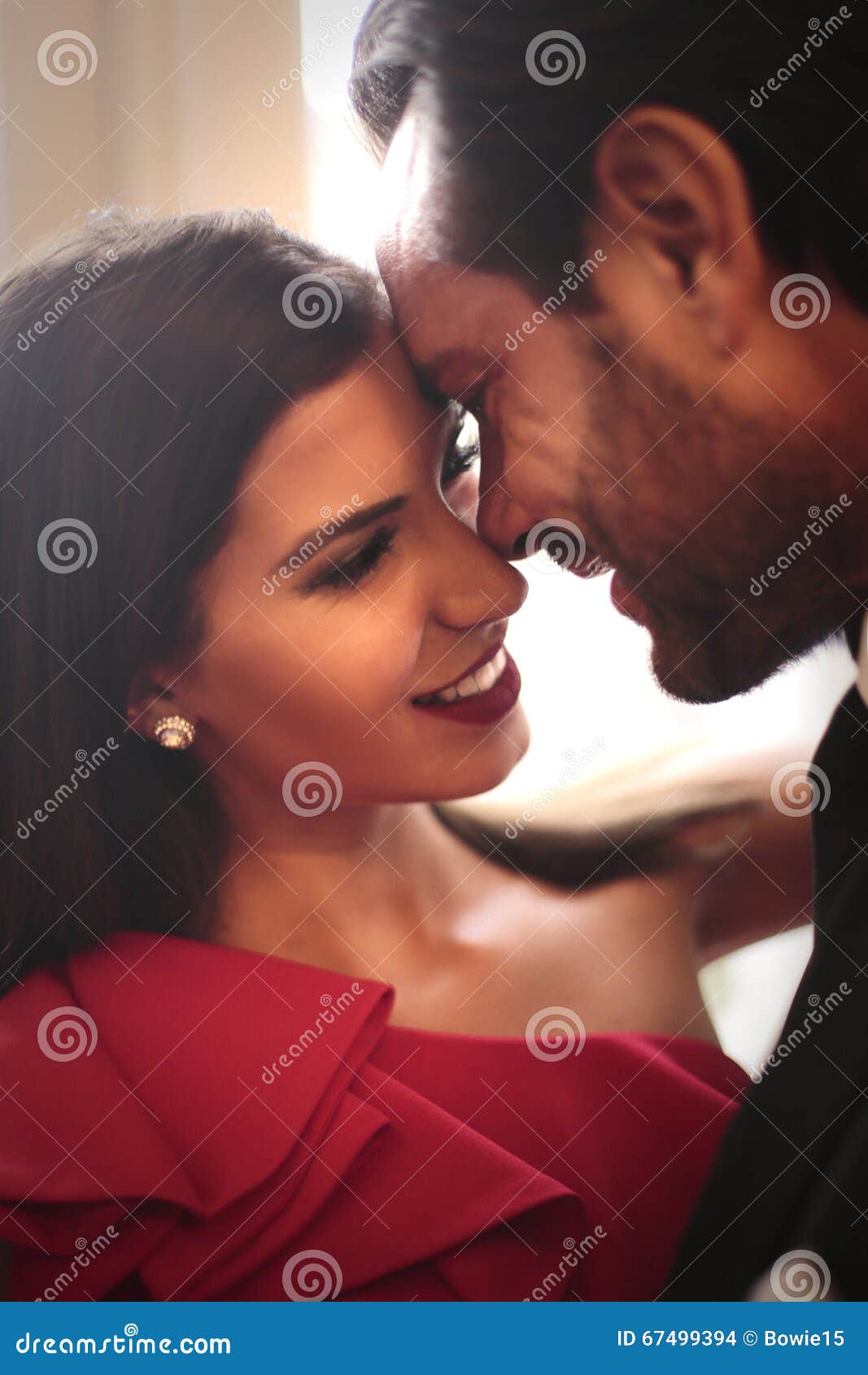 Couple showing affection stock photo. Image of earring - 67499394