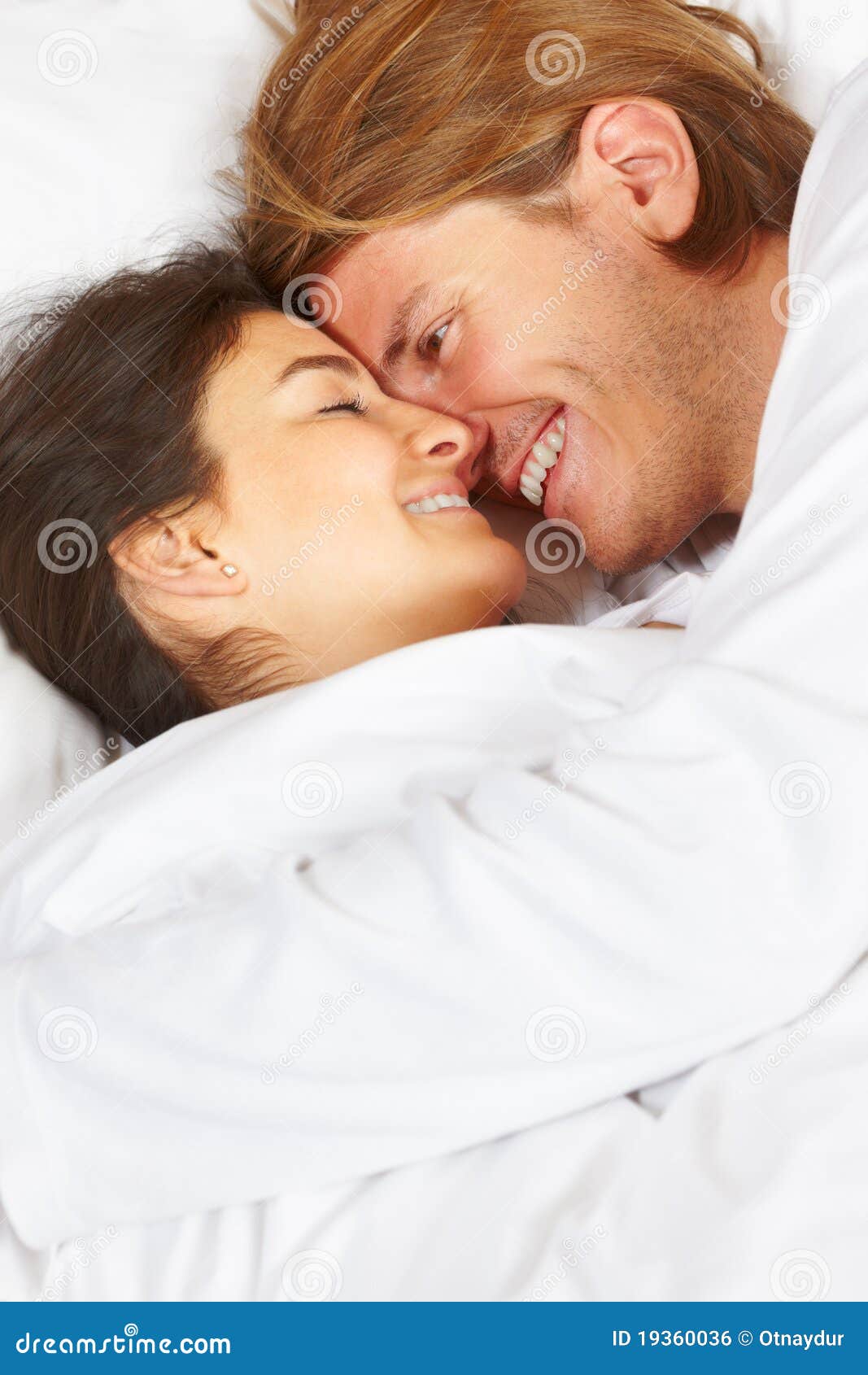 Couple Showing Romance on Bed Stock Photo - Image of casual, bedroom ...