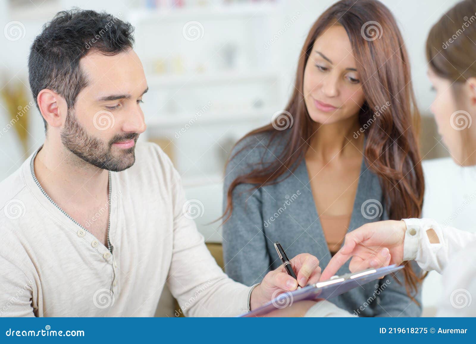 Couple signing form stock image. Image of together, insurance - 219618275