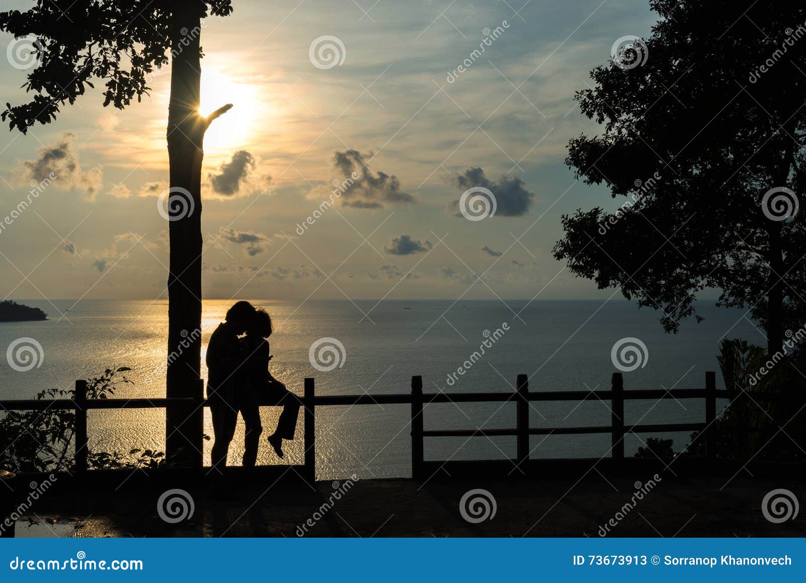 Couple Silhouette Cuddling and Watching Sun at Sunset on the Beach ...