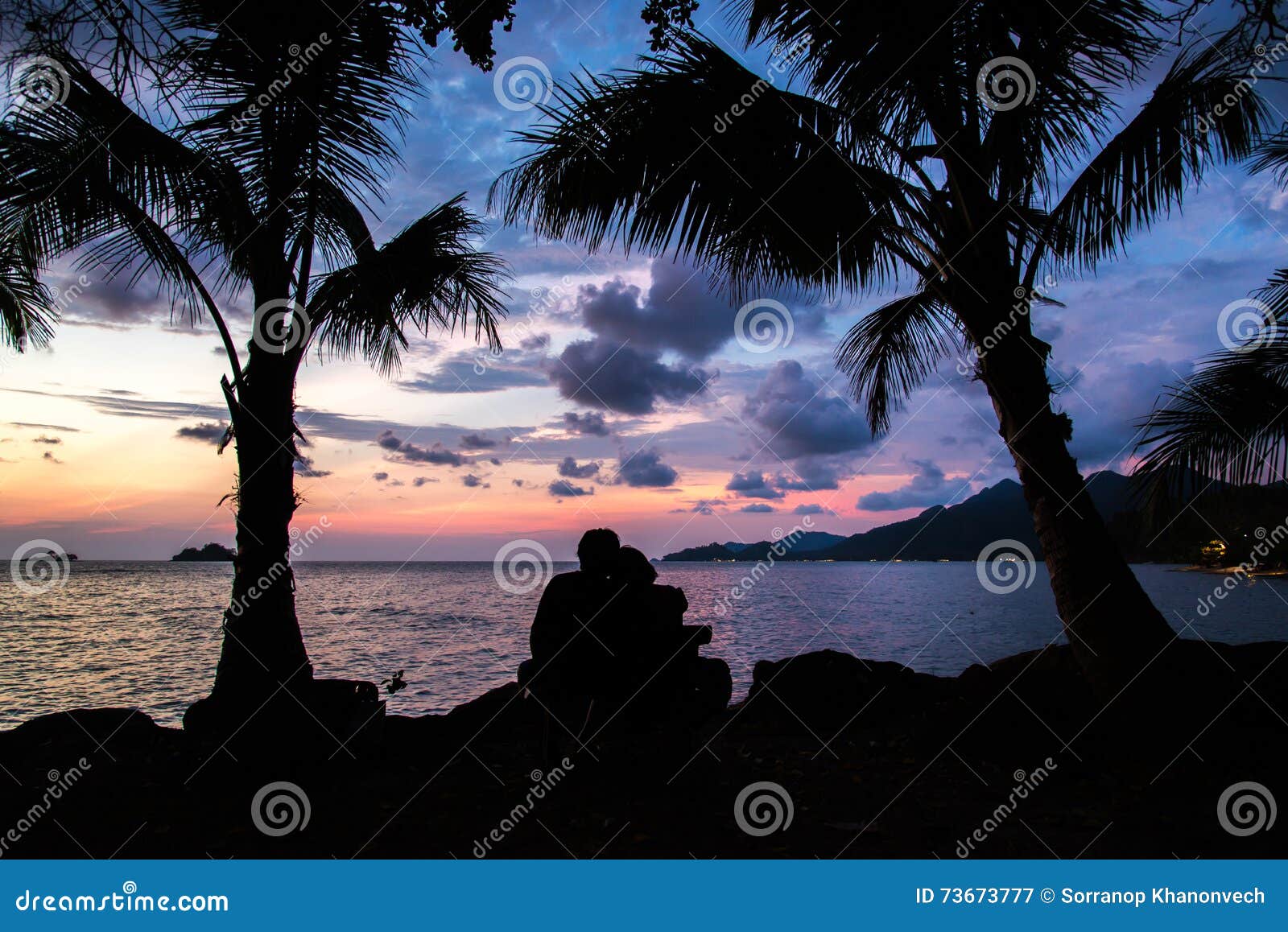 Couple Silhouette Cuddling and Watching Sun at Sunset on the Beach ...