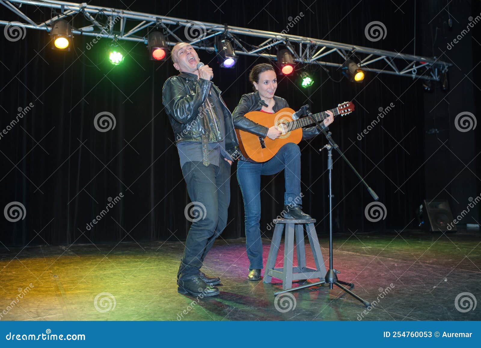 Couple Singing and Playing Guitar on Stage Stock Image - Image of black ...