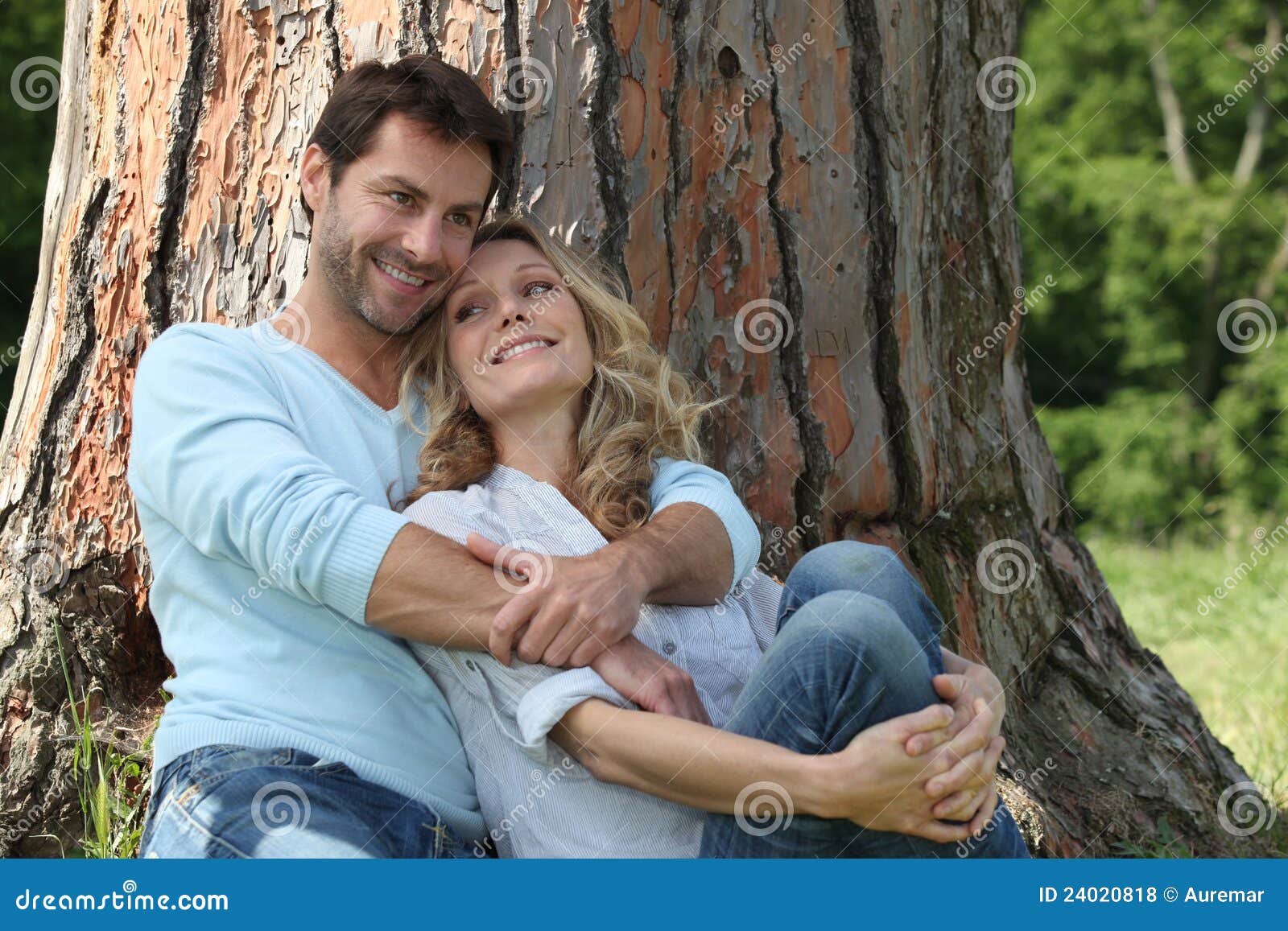 Couple Sitting Against a Tree Stock Photo - Image of sweat, adults ...