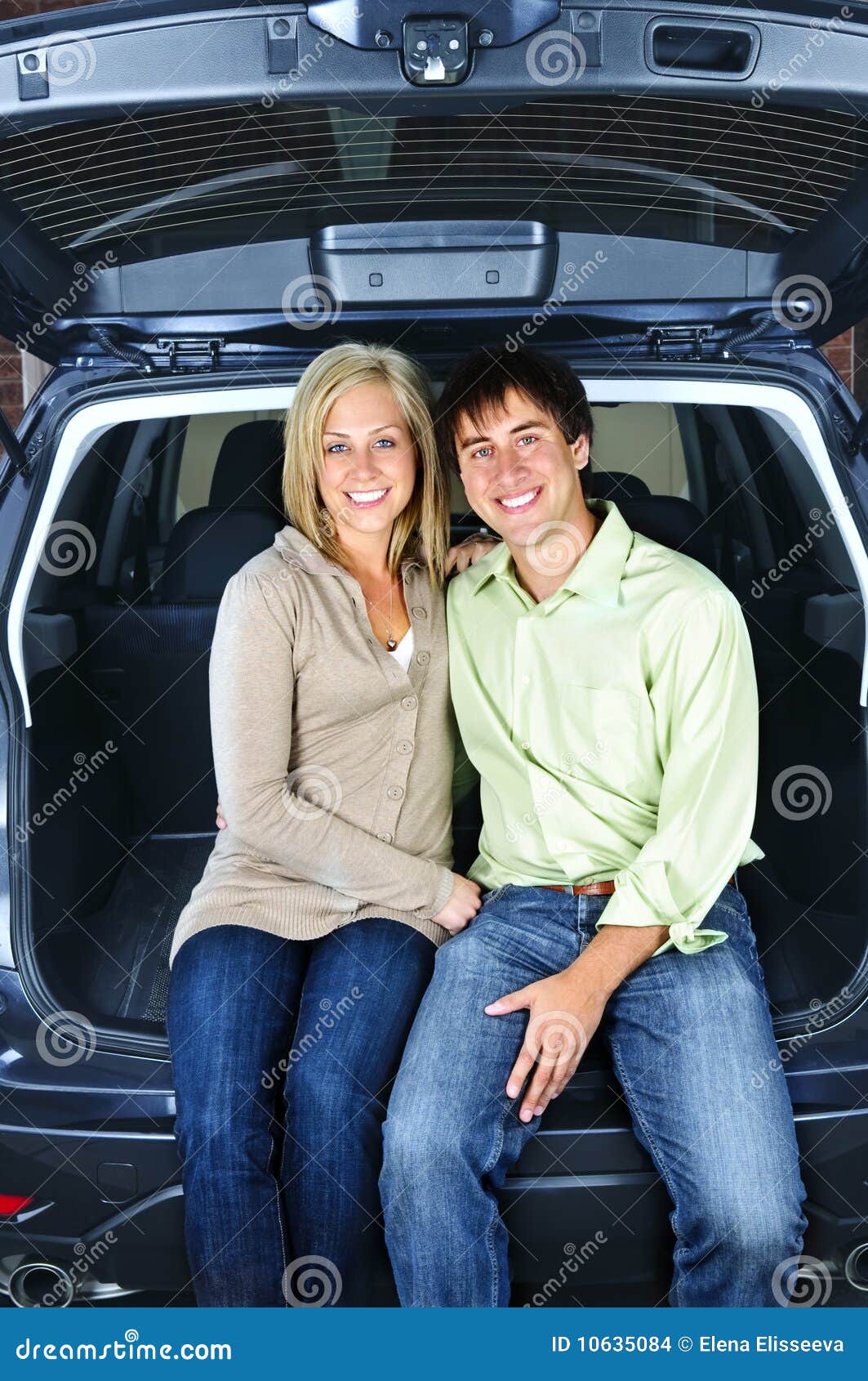 Couple Sitting in Back of Car Stock Photo - Image of smiling, sport ...