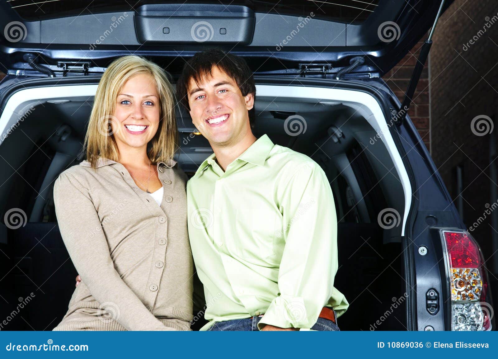 Couple Sitting in Back of Car Stock Photo - Image of female, hatch ...